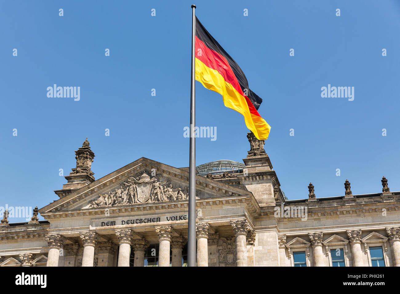 Closeup view of famous Reichstag building with German flag, seat of the ...