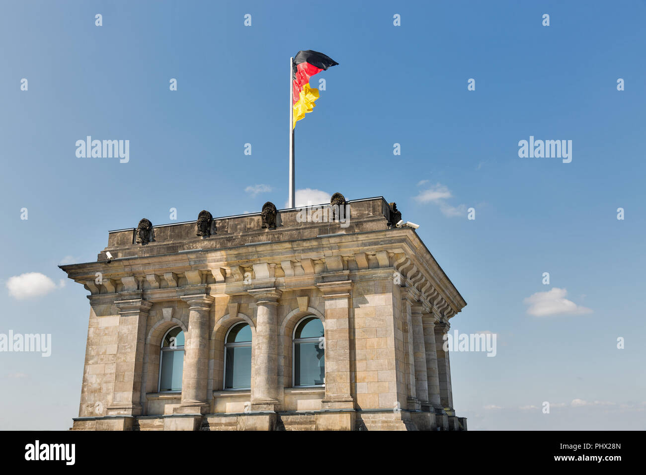 Reichstag building with german flag hi-res stock photography and images ...