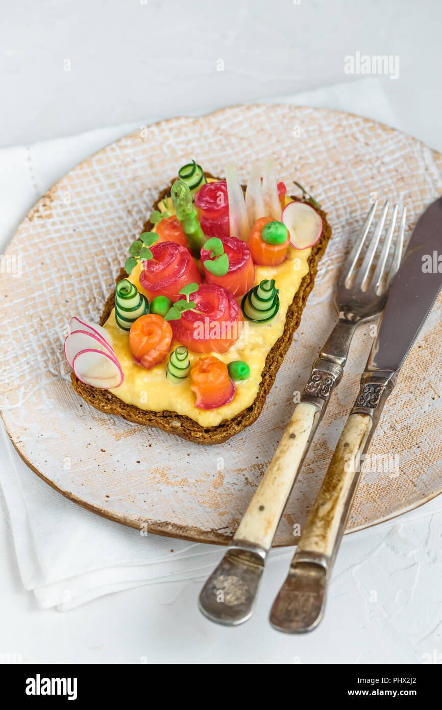 Salmon and scramble egg sandwich on rye bread, smorrebrod Stock Photo - Alamy