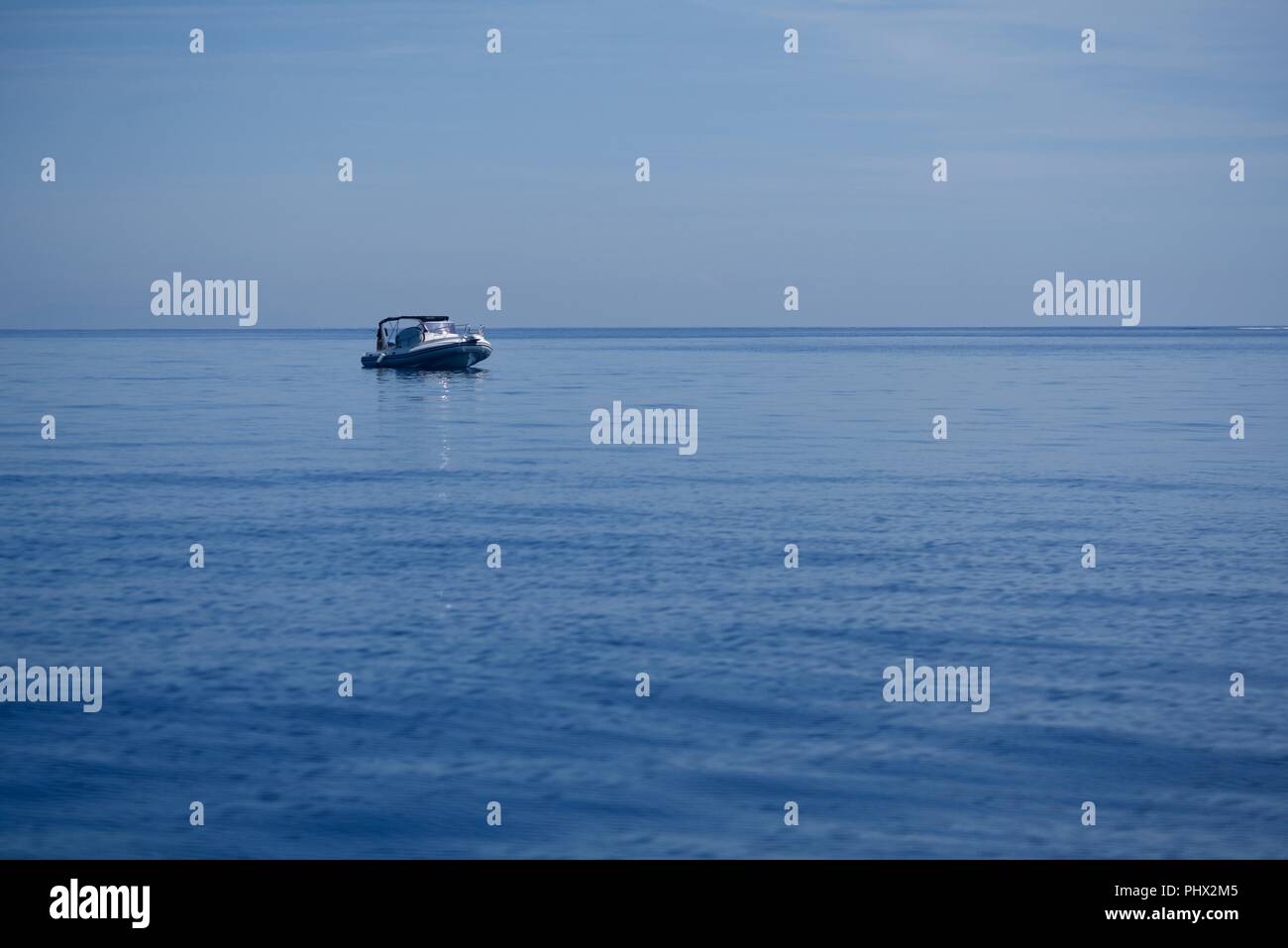 recreational craft on the sea under the blue sky Stock Photo - Alamy