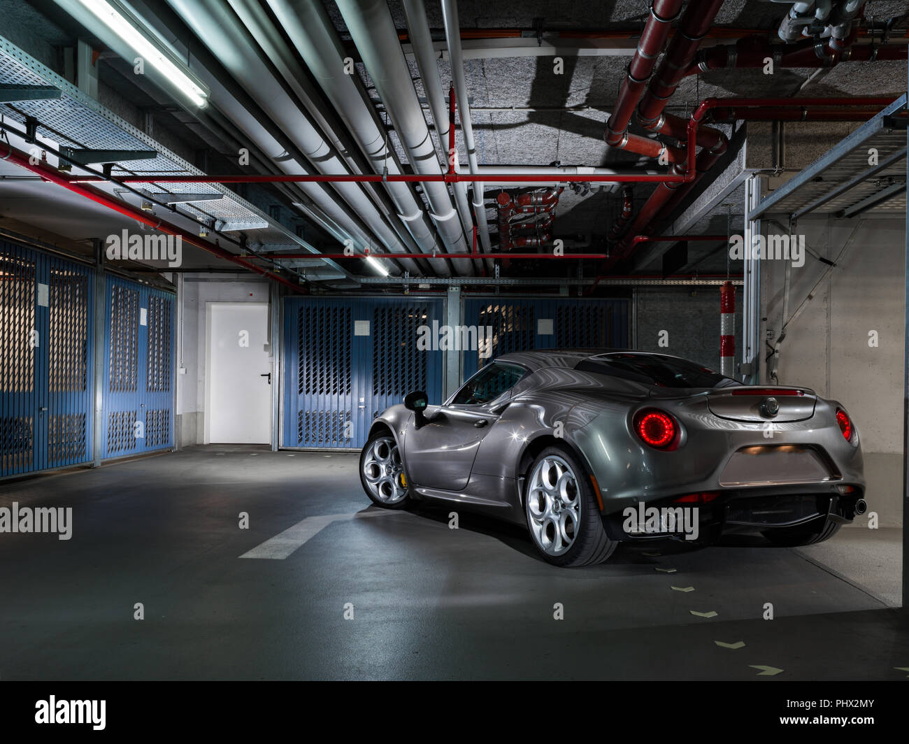 Shiny grey super sports car in garage waiting for next adventure Stock ...