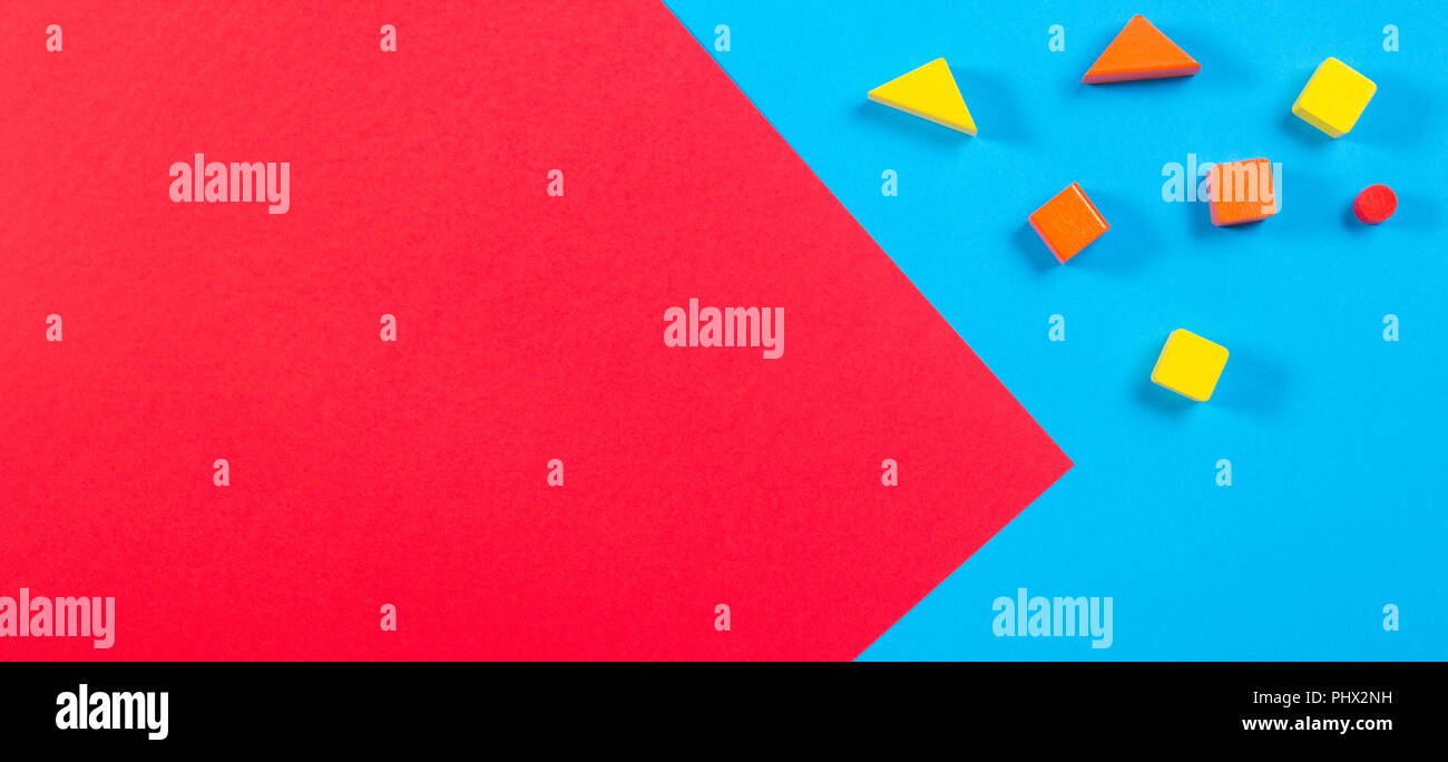 Colorful wooden blocks on blue and red background Stock Photo - Alamy