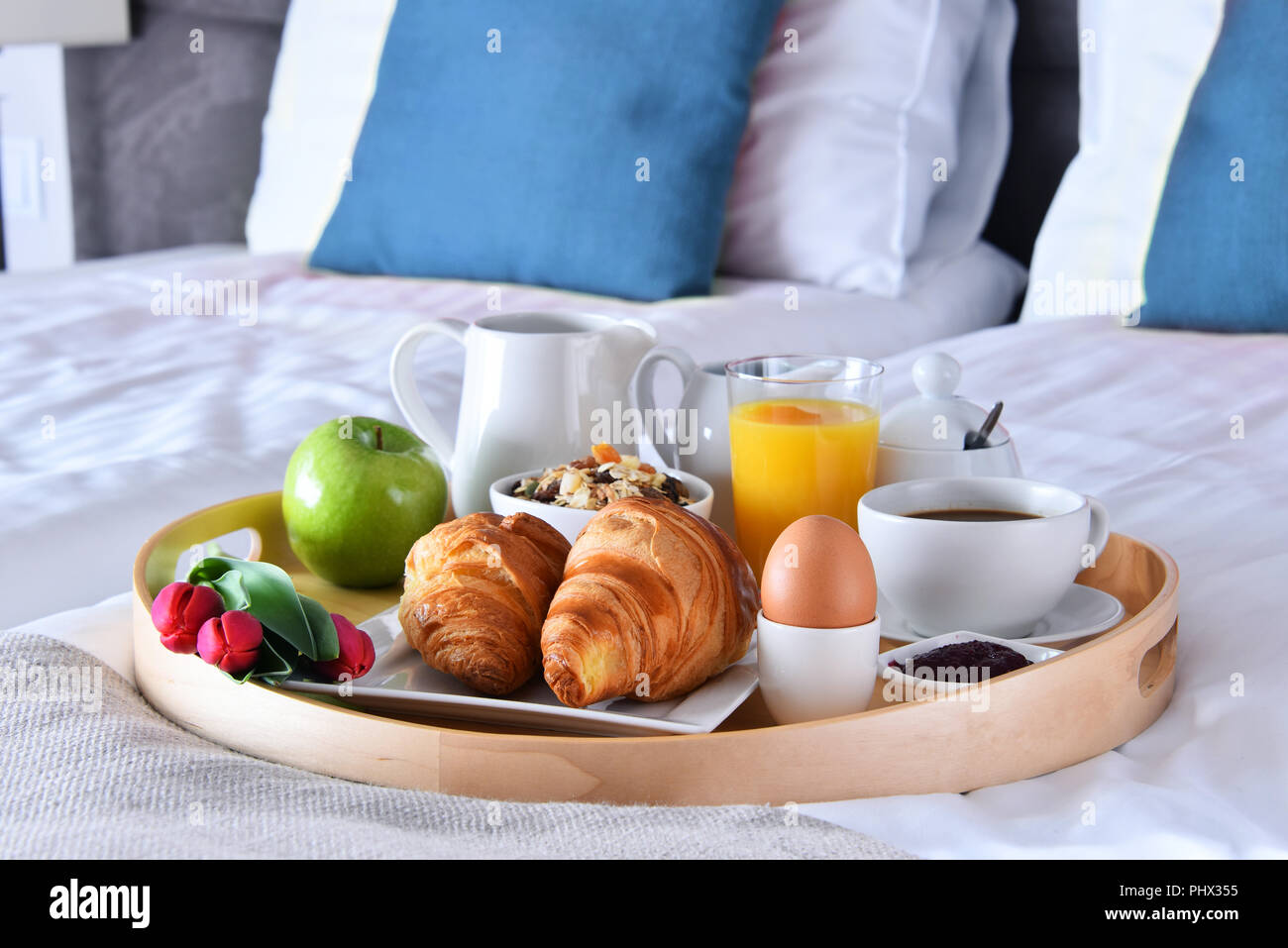 Breakfast on tray in bed in hotel room Stock Photo - Alamy