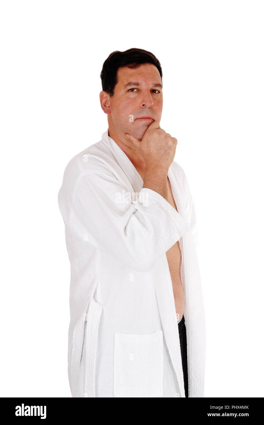 Man standing in white bathrobe, looking to camera Stock Photo - Alamy