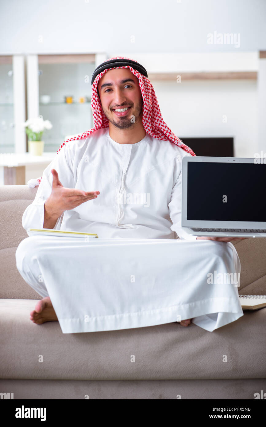 Arab man working at home on his work Stock Photo - Alamy