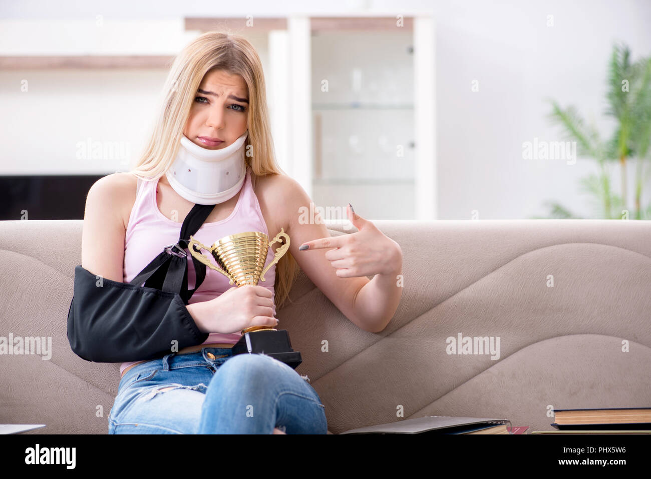 Woman injured during sport game Stock Photo - Alamy