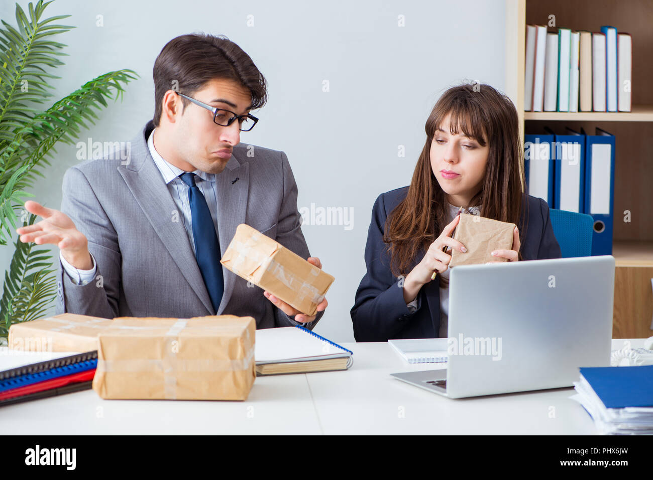 Business people receiving new mail and parcels Stock Photo - Alamy