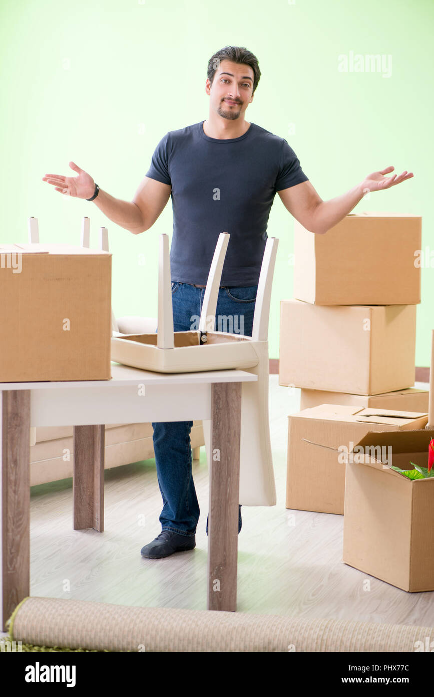 Man moving house with boxes Stock Photo - Alamy