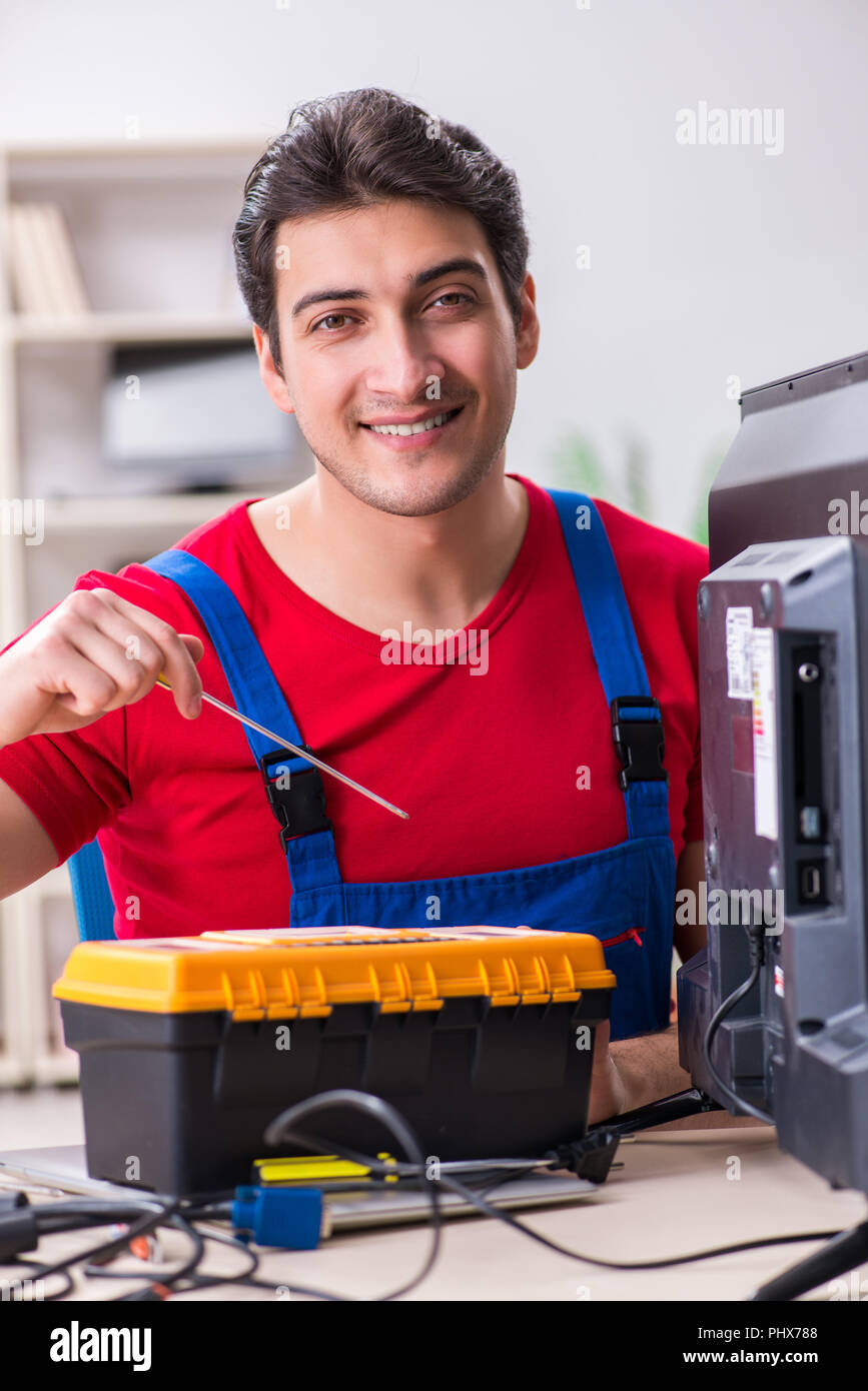 Professional repair engineer repairing broken tv Stock Photo - Alamy