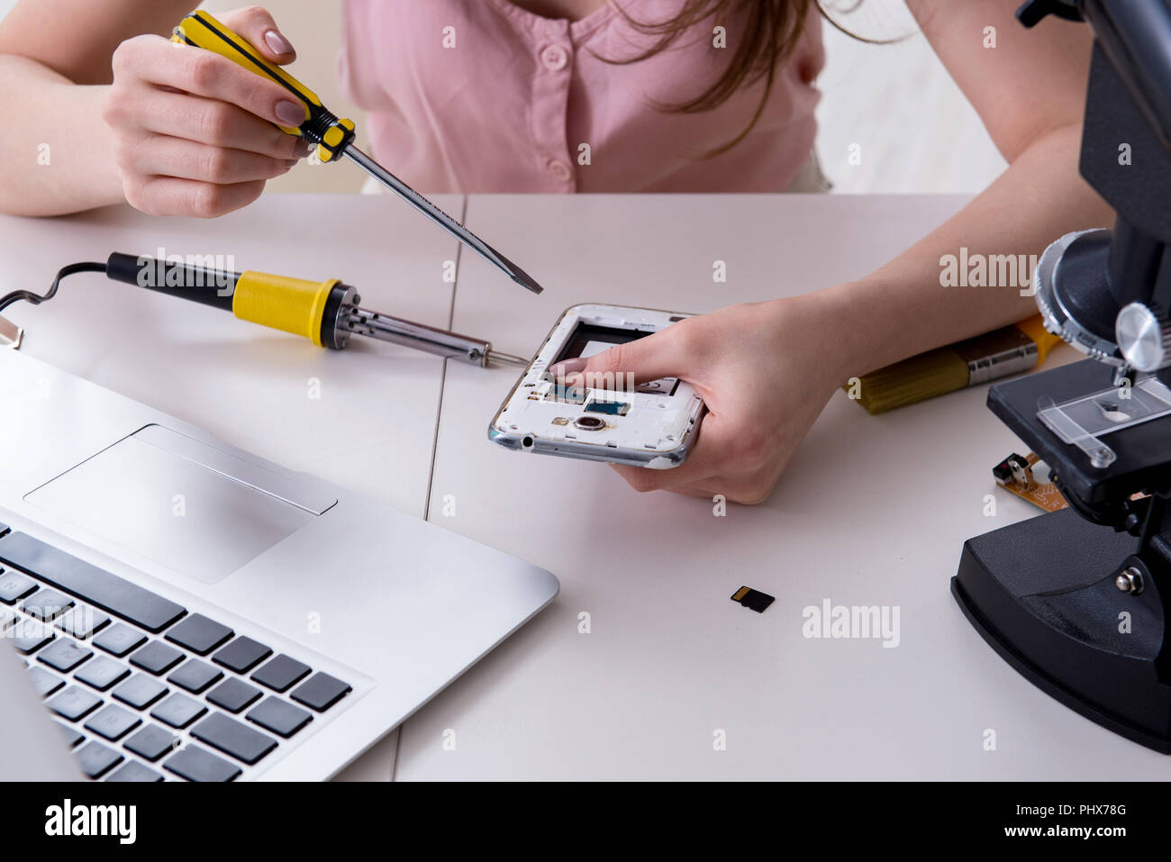 Mobile phone repair in workshop Stock Photo - Alamy