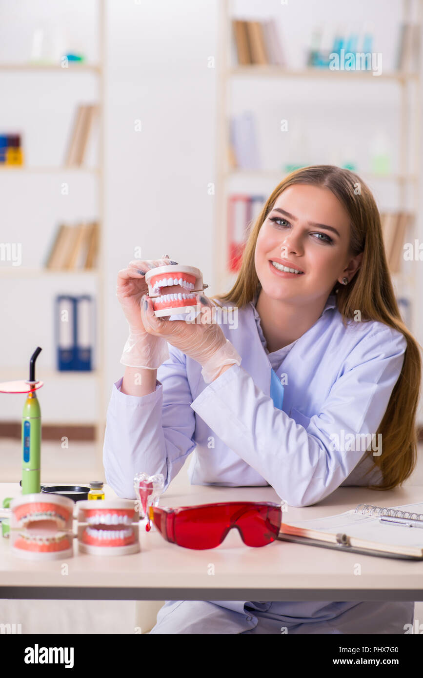 Dentistry student practicing skills in classroom Stock Photo - Alamy