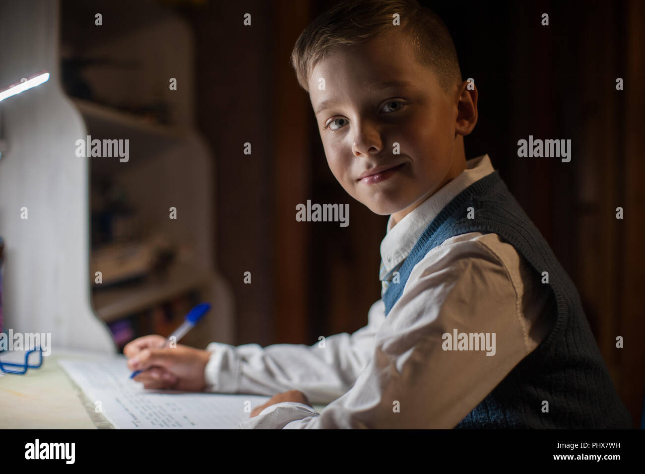 pupil boy does his homework Stock Photo - Alamy