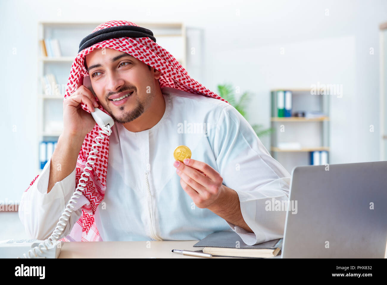 Arab man with bitcoin in cryptocurrency mining concept Stock Photo - Alamy