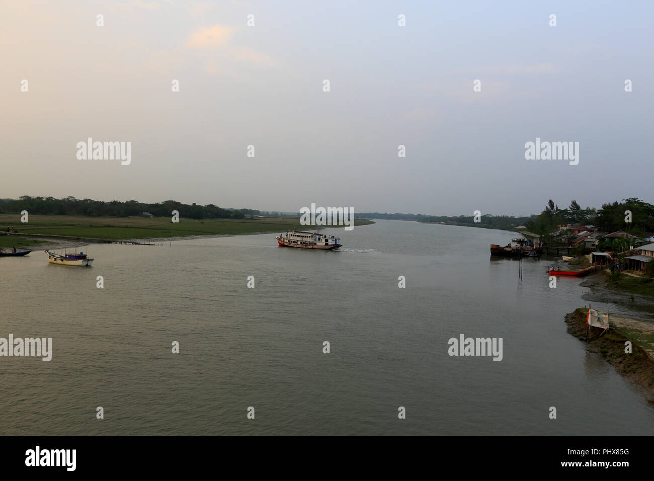 A small passenger vessel on Tetulia River, Patuakhali, Bangladesh Stock ...