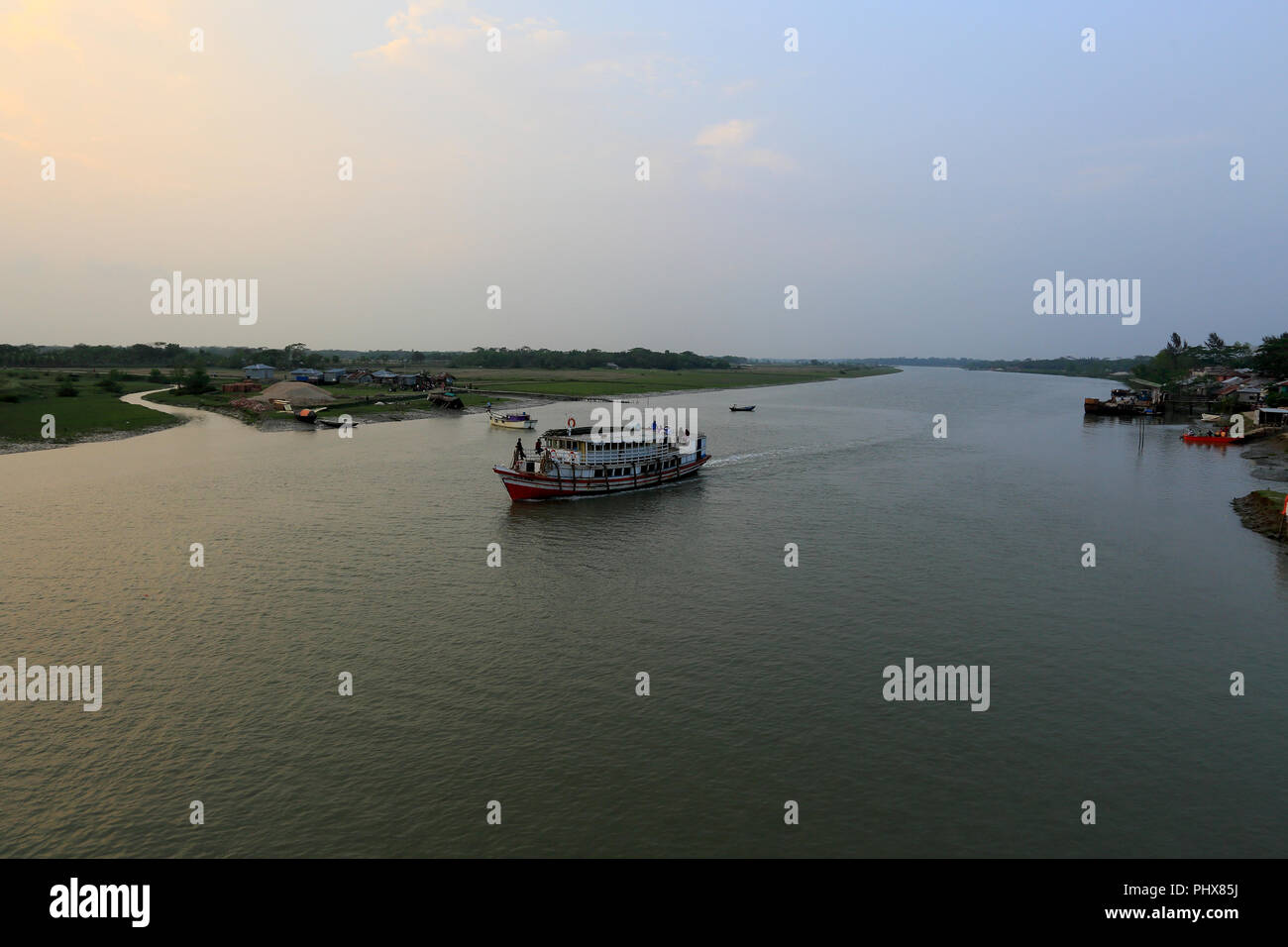 A small passenger vessel on Tetulia River, Patuakhali, Bangladesh Stock ...