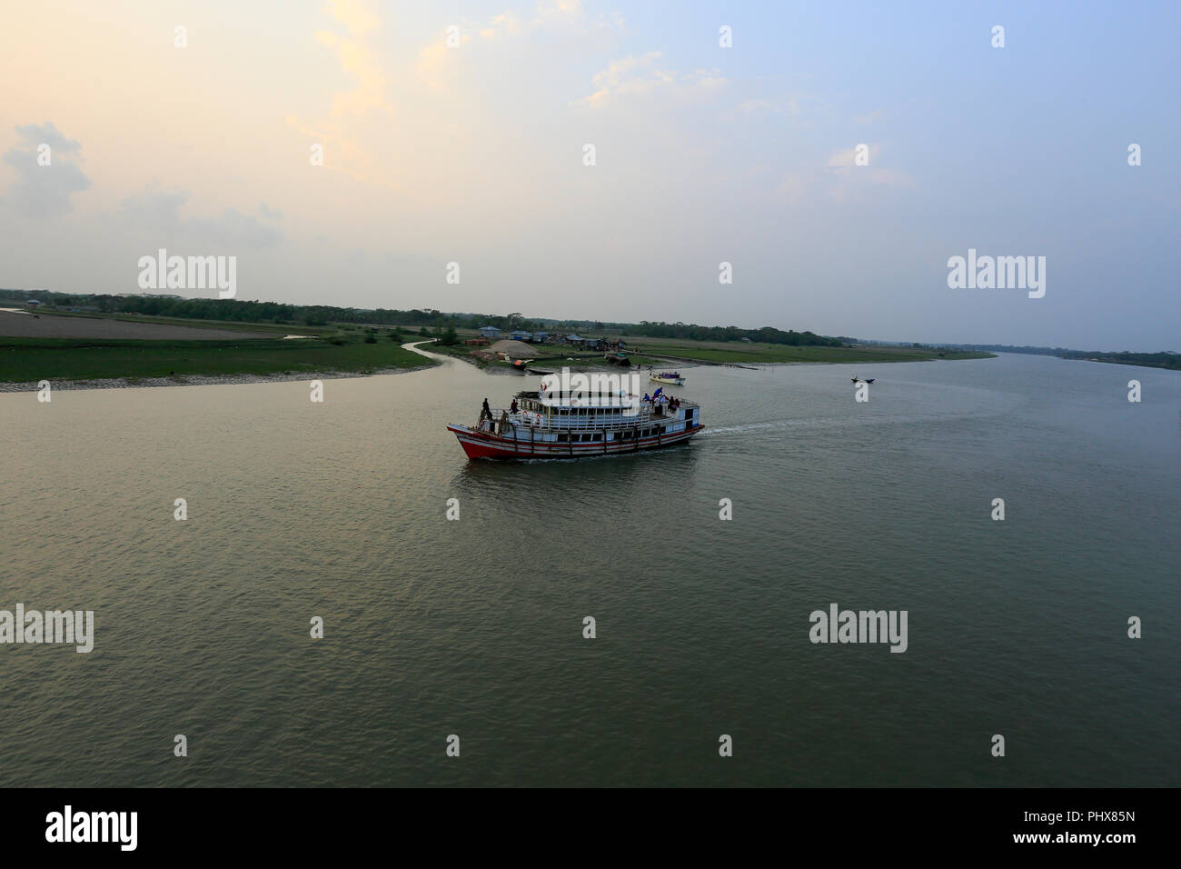 A small passenger vessel on Tetulia River, Patuakhali, Bangladesh Stock ...