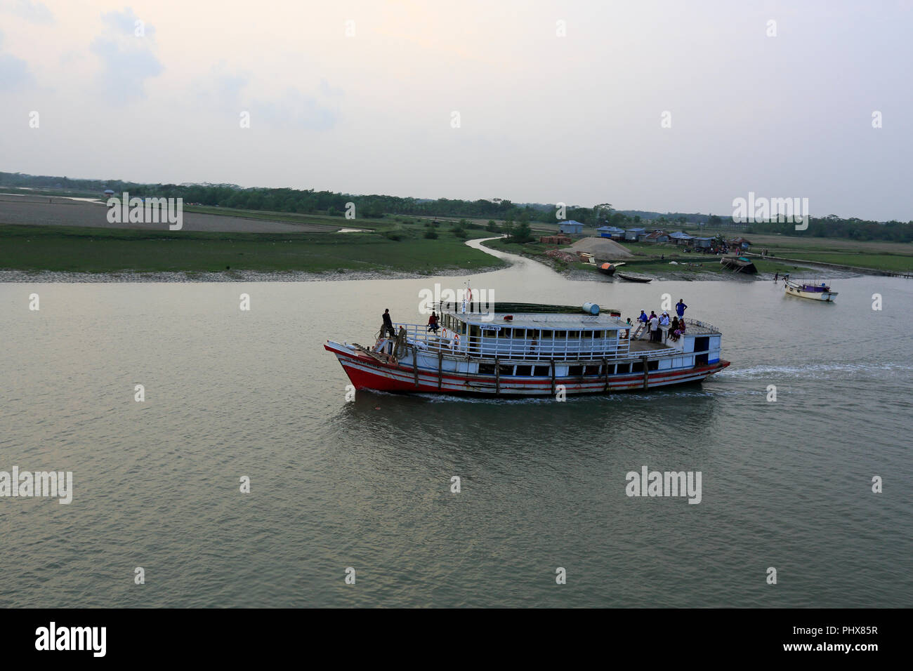 A small passenger vessel on Tetulia River, Patuakhali, Bangladesh Stock ...