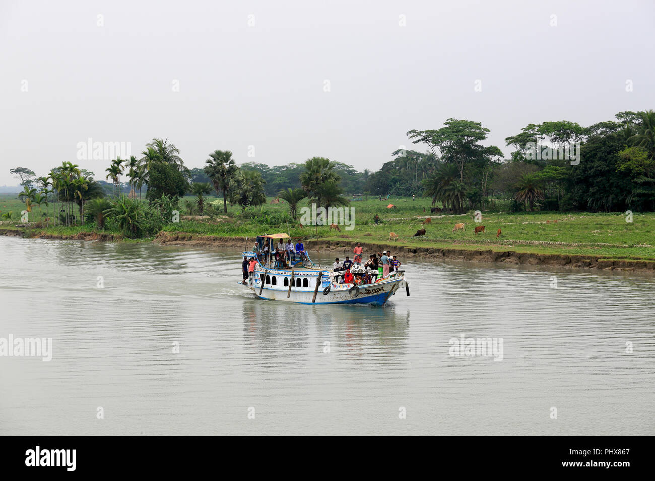 A small passenger vessel on Tetulia River, Patuakhali, Bangladesh Stock ...