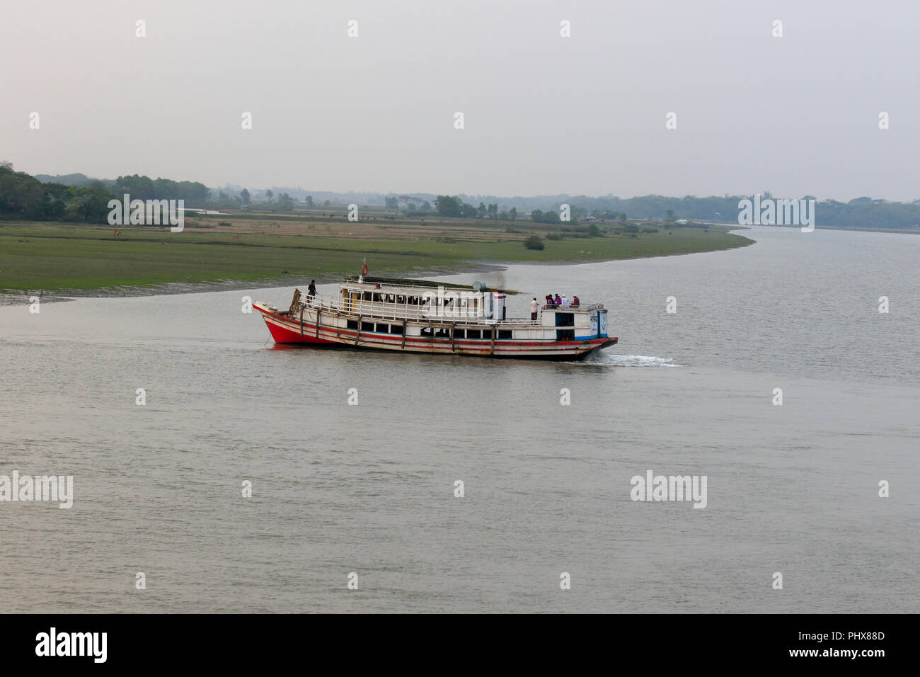 A small passenger vessel on Tetulia River, Patuakhali, Bangladesh Stock ...