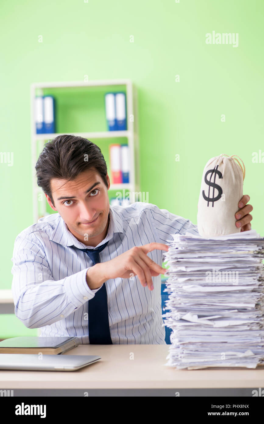 Businessman having problems with paperwork and workload Stock Photo - Alamy