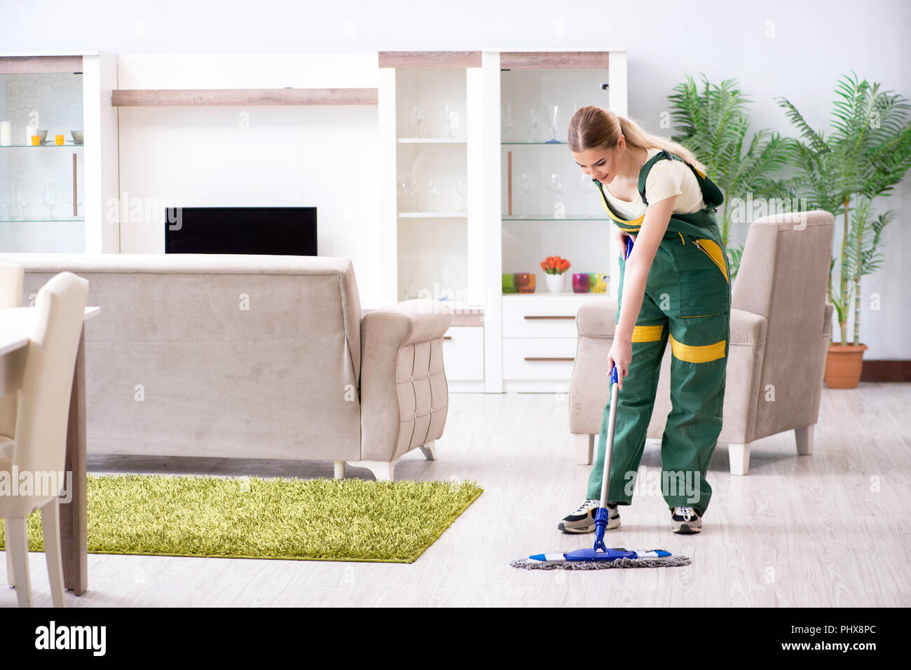 Woman female cleaner cleaning floor Stock Photo - Alamy