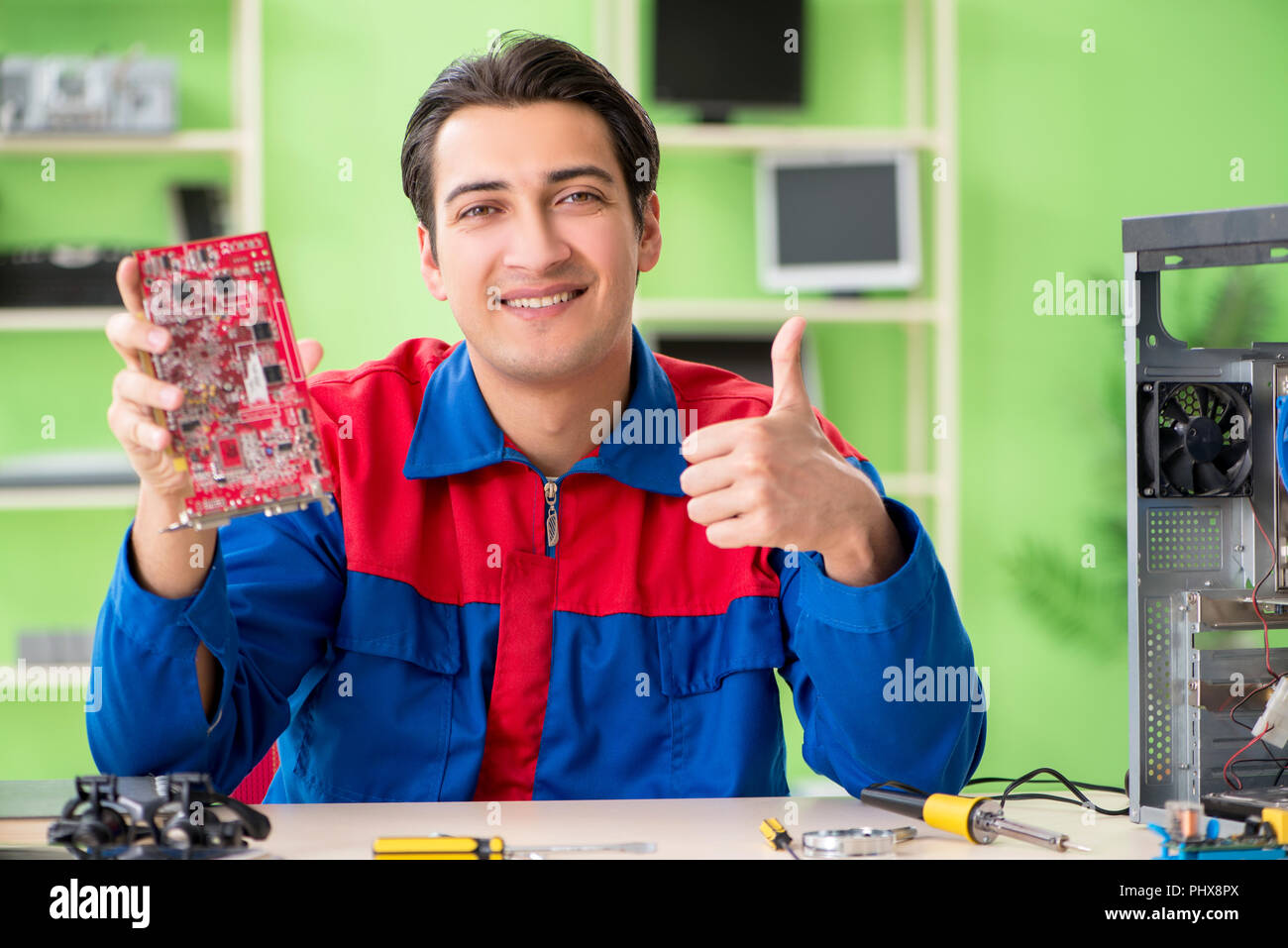 Computer engineer repairing broken desktop Stock Photo - Alamy