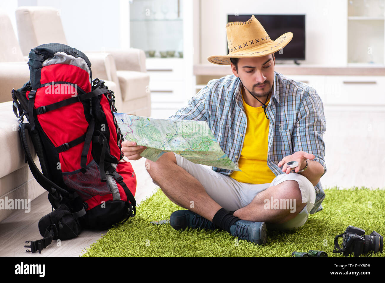 Man planning his travel with map Stock Photo - Alamy