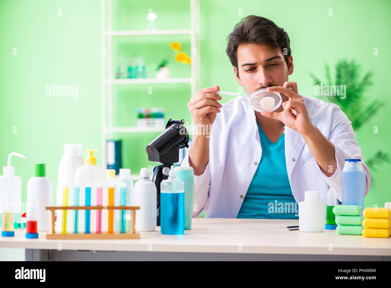 Chemist testing soap in the lab Stock Photo - Alamy