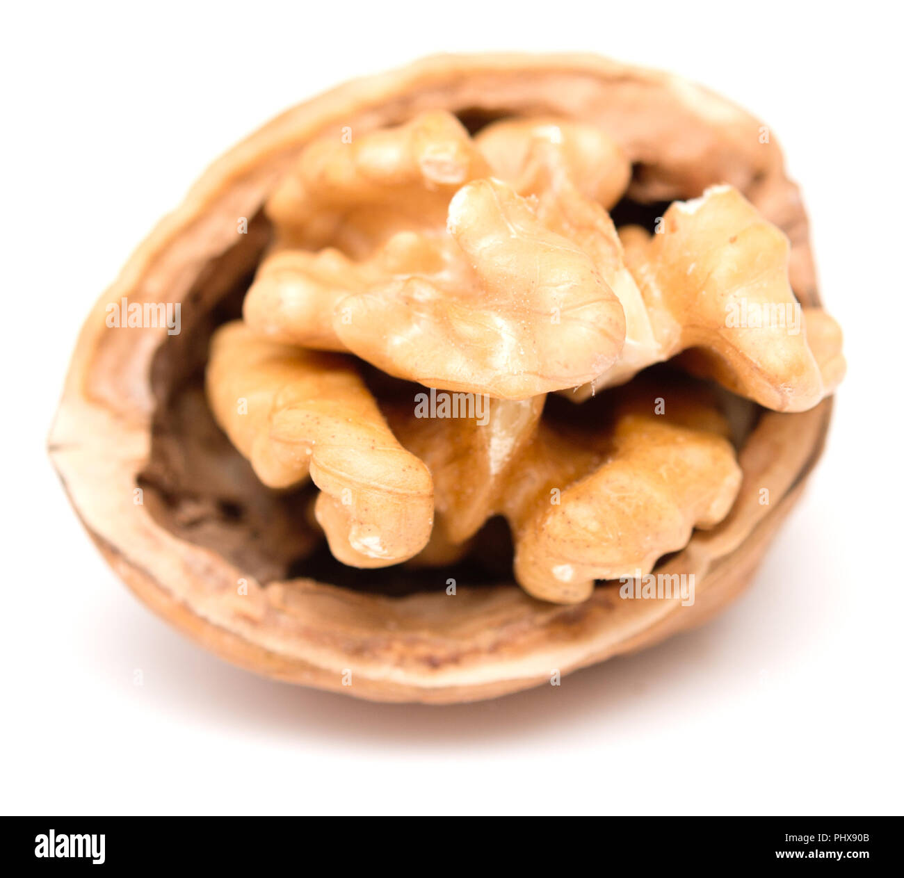 Walnuts on yellow background Cut Out Stock Images & Pictures - Alamy