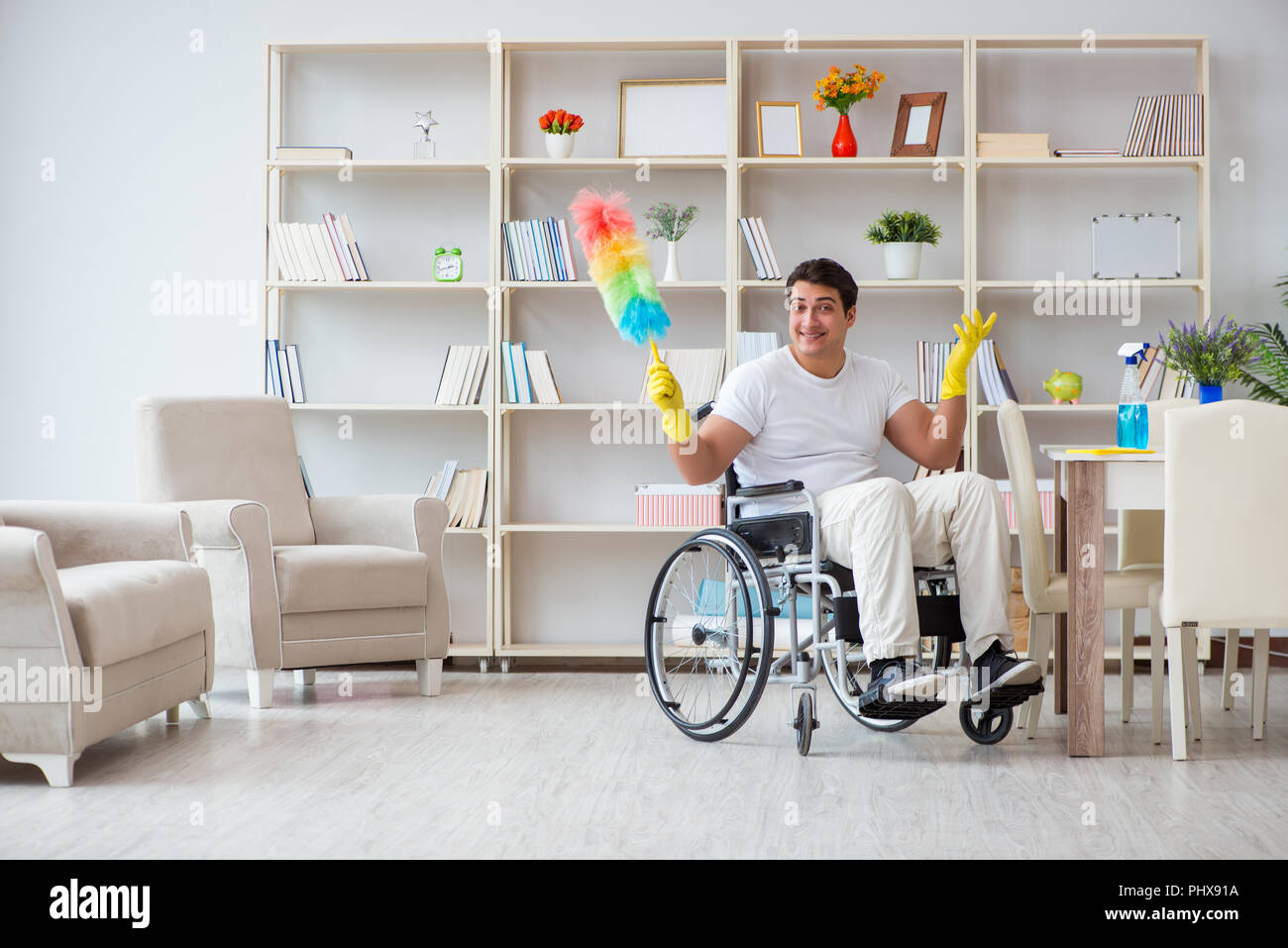 Disabled cleaner doing chores at home Stock Photo - Alamy
