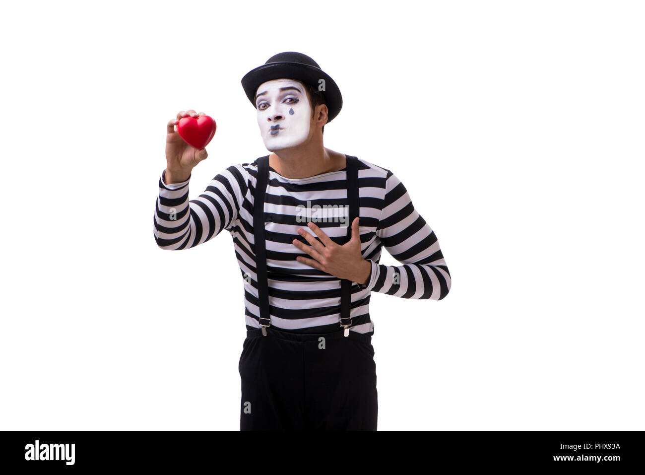 Mime holding red heart isolated on white background Stock Photo - Alamy