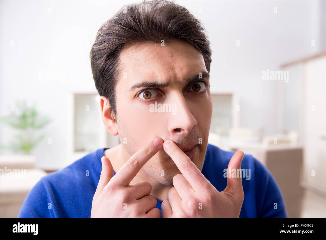 Man panicking because of pimples on the skin Stock Photo - Alamy