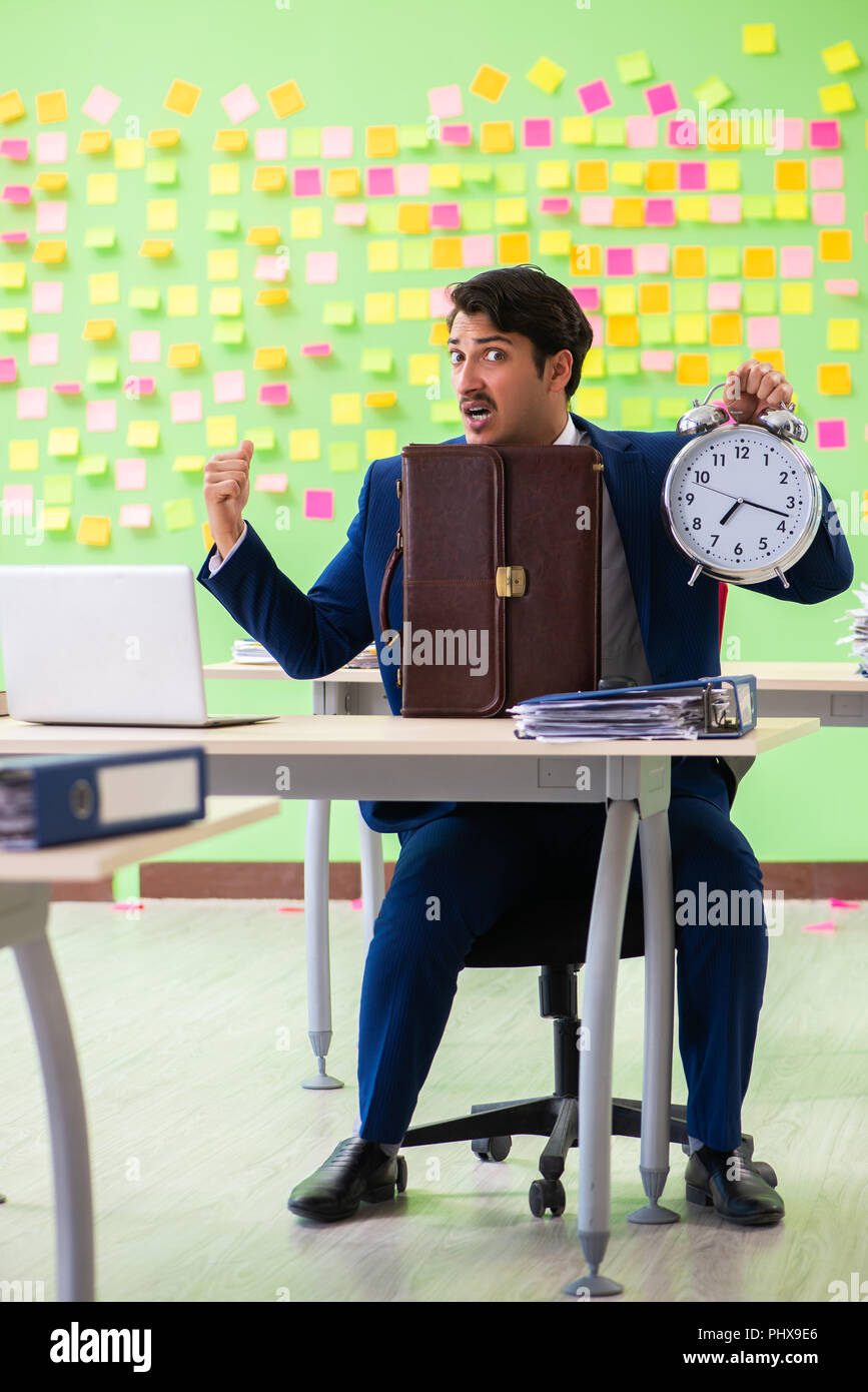 Businessman with many conflicting priorities in time management Stock ...