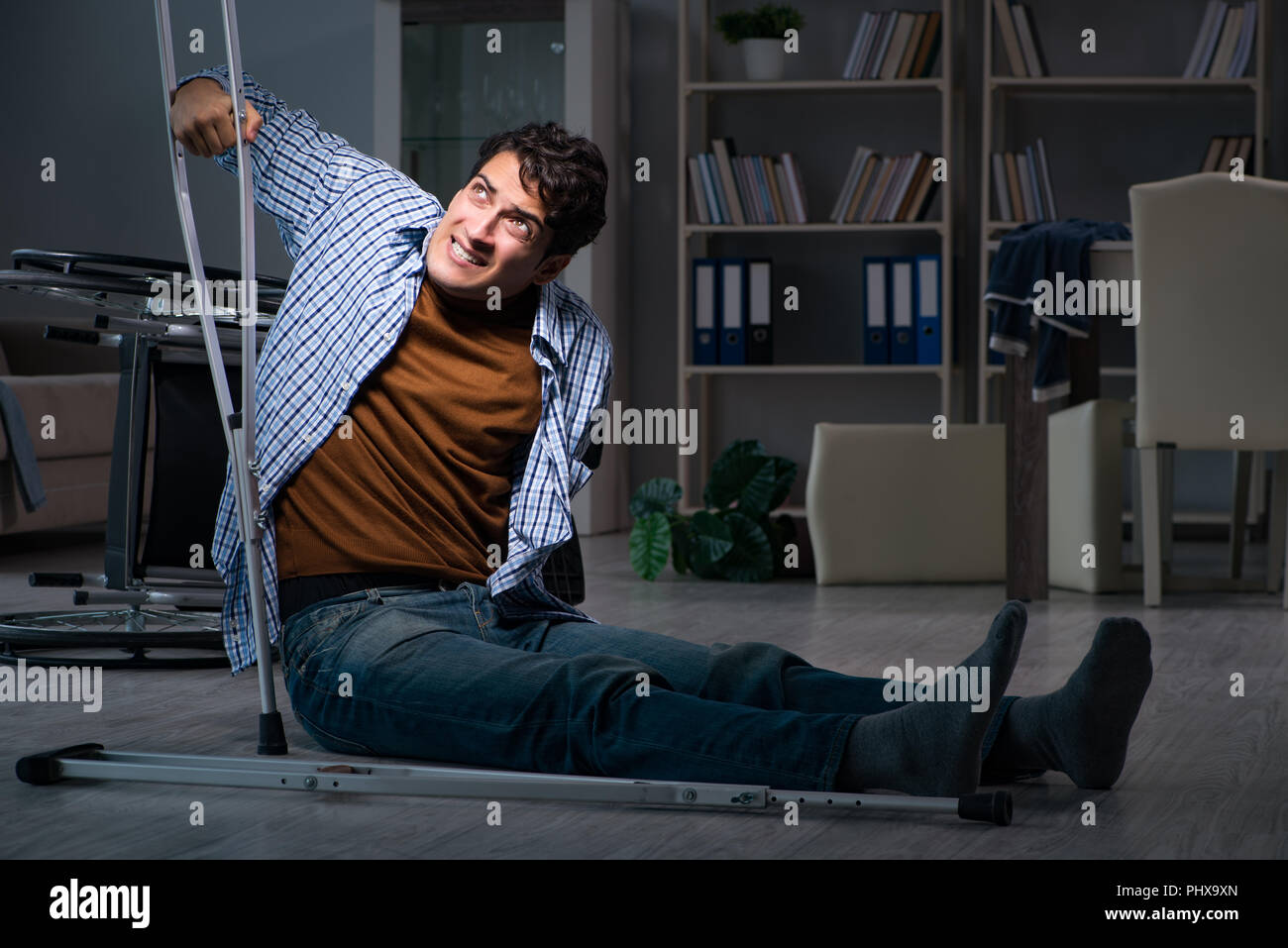 Man falling off chair hi-res stock photography and images - Alamy