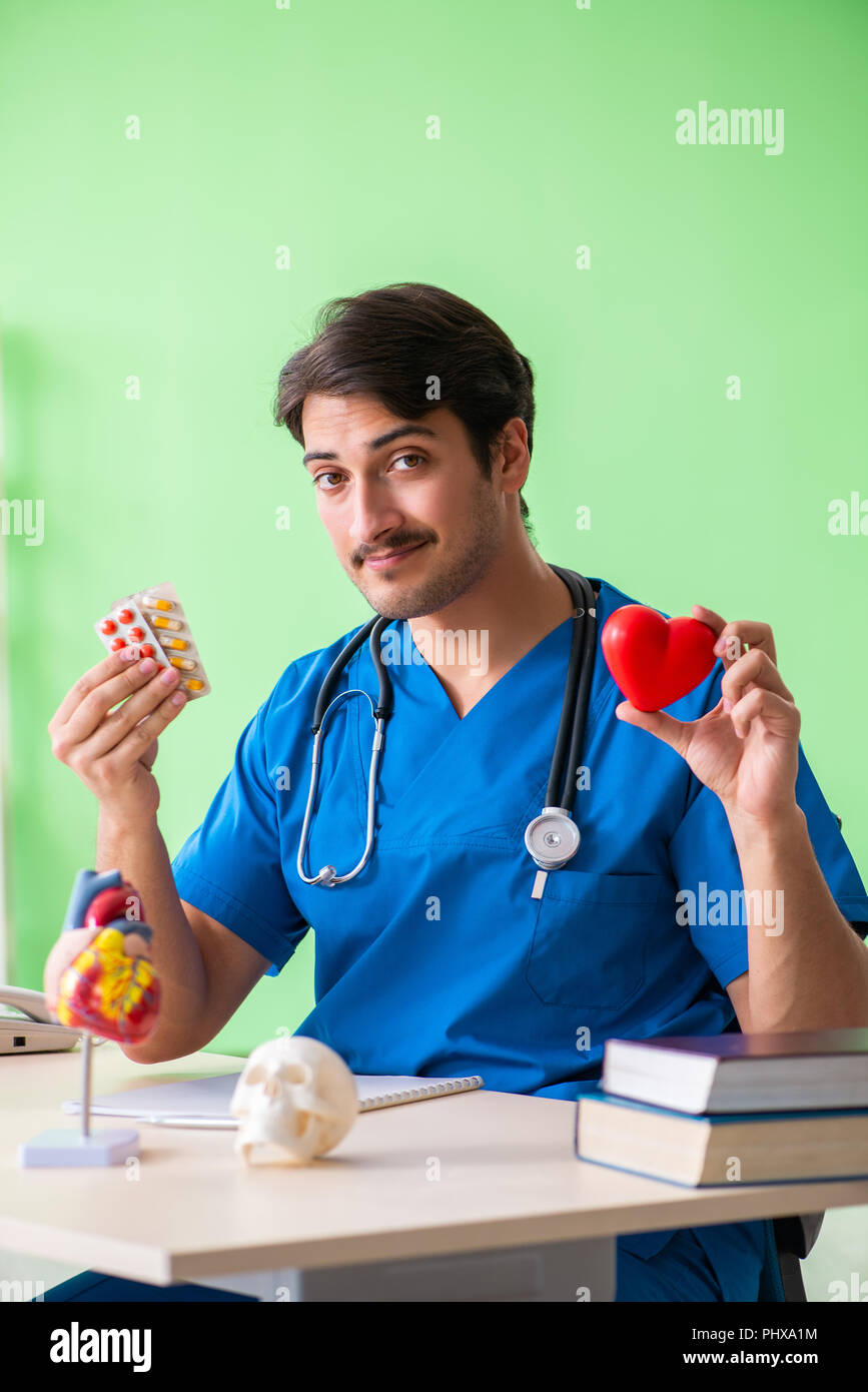 Doctor student explaining heart problems Stock Photo - Alamy