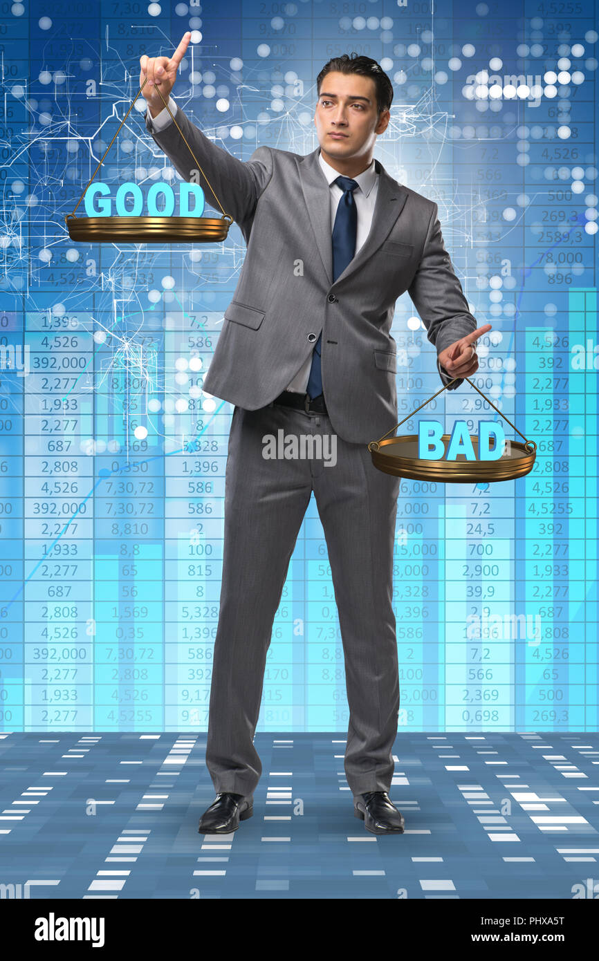 Businessman choosing between good and bad Stock Photo - Alamy