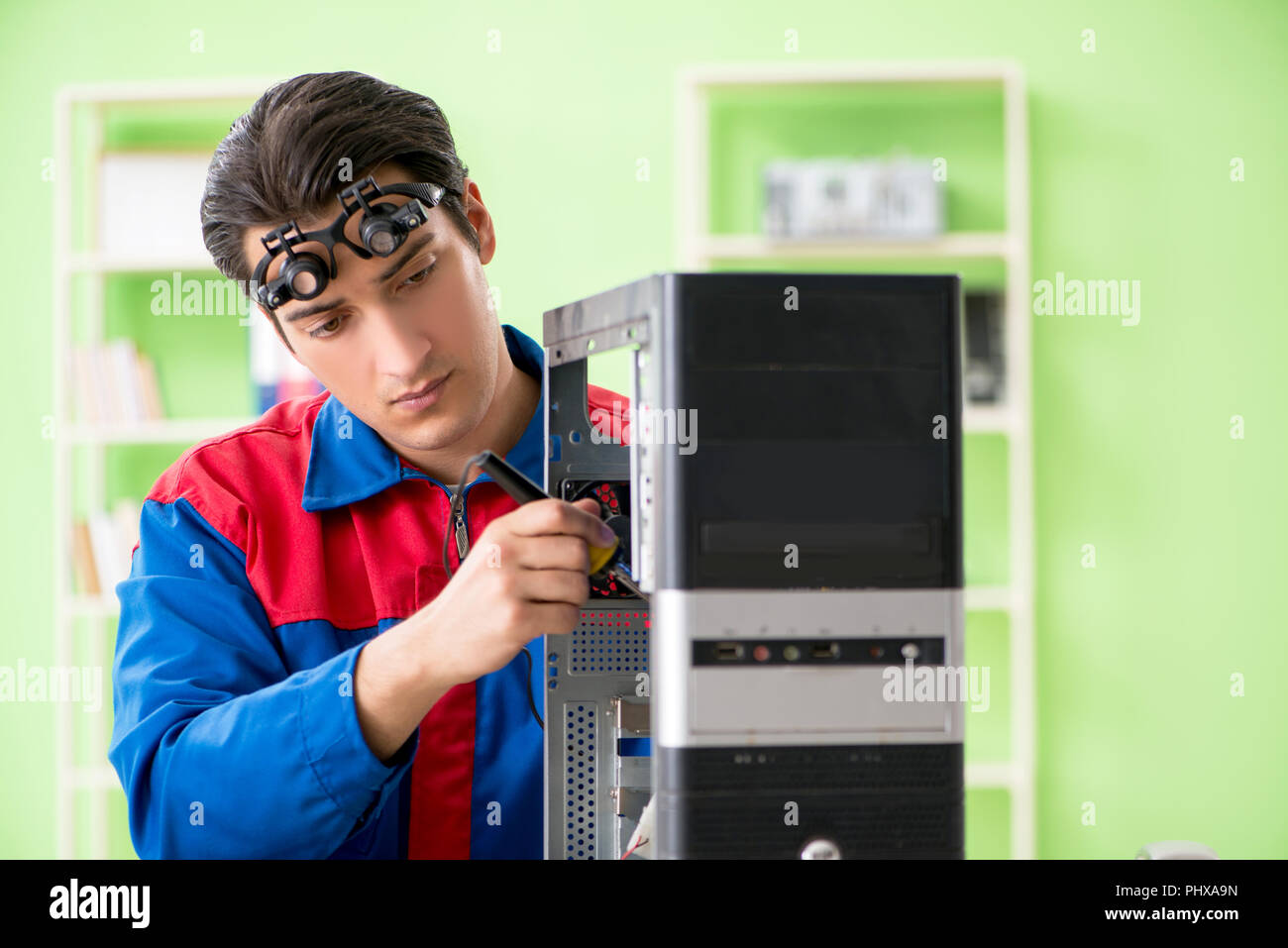 Computer engineer repairing broken desktop Stock Photo - Alamy