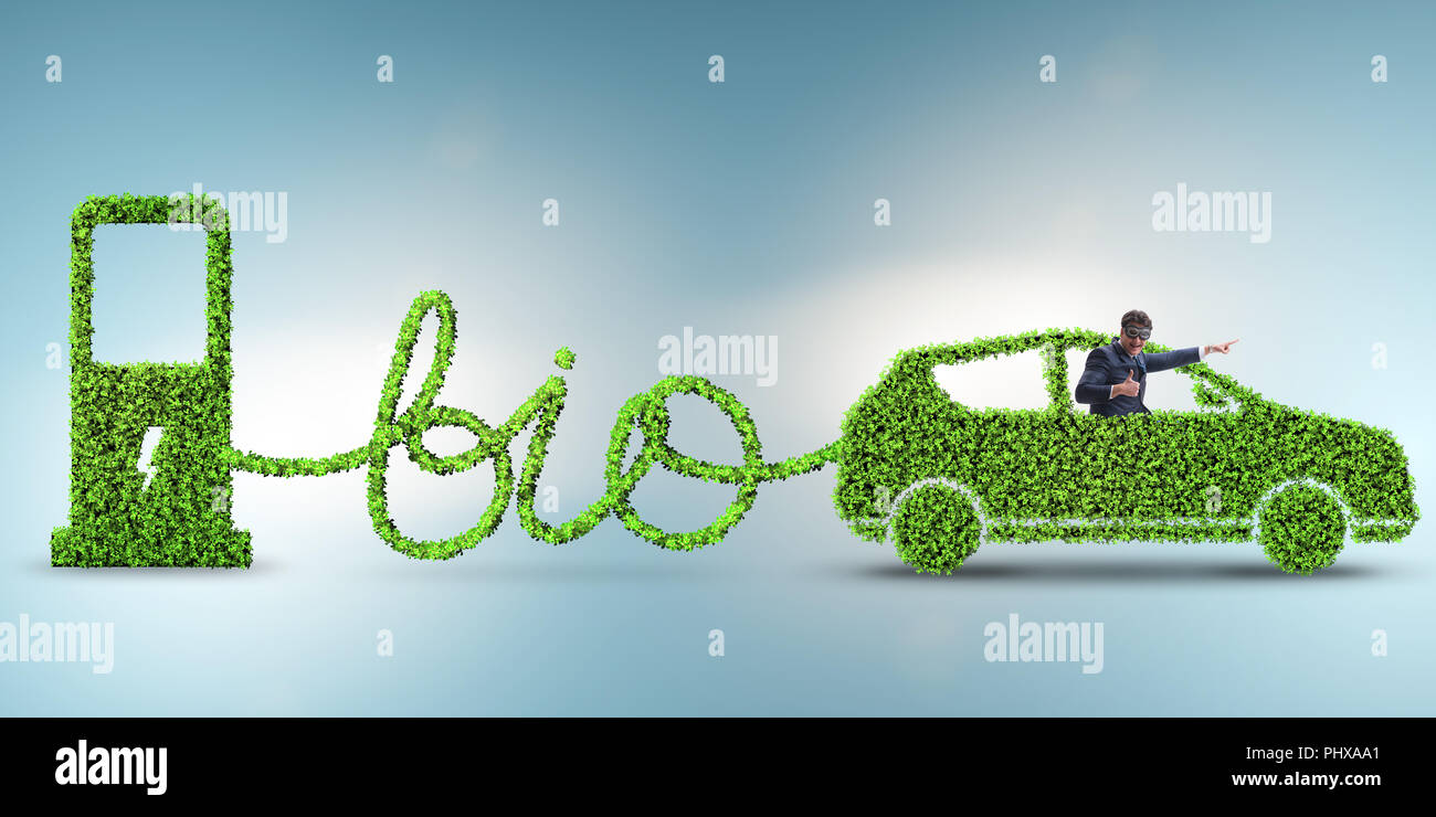 Businessman with car powered with biofuel Stock Photo - Alamy