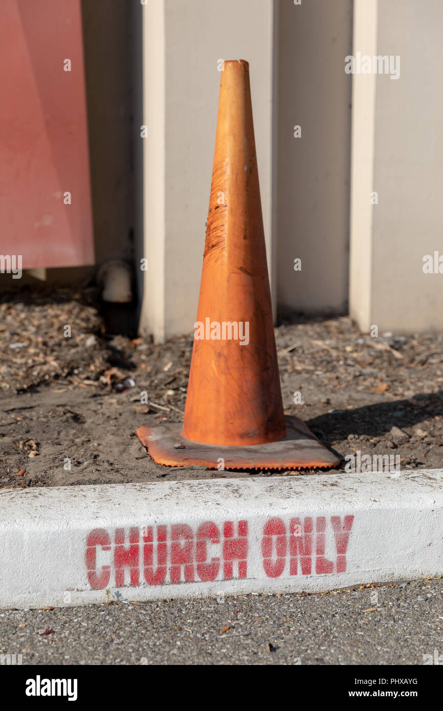 "Church Only", text on kerb stone, and orange traffic cone Stock Photo ...