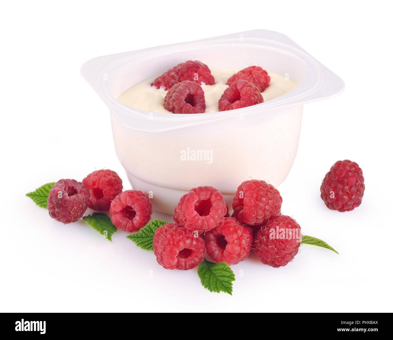 yoghurt with raspberry on a white background Stock Photo - Alamy