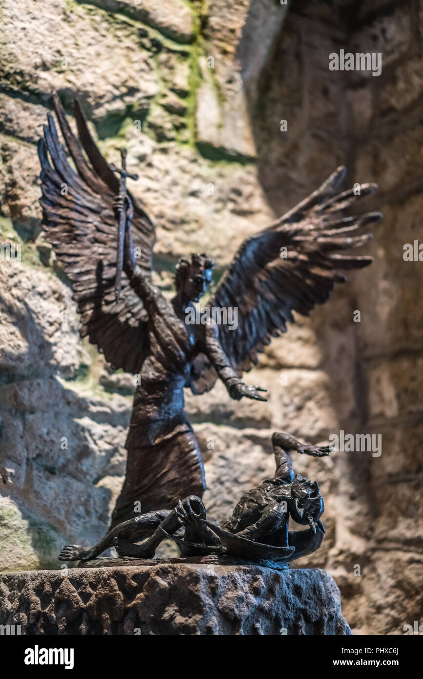 Marazion, England - May 2018 : Sculpture depicting angel killing demon ...