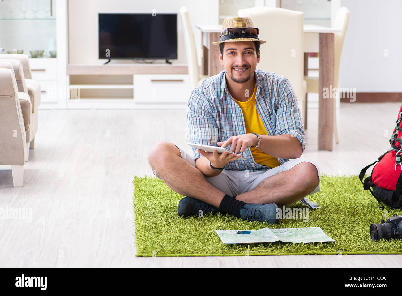 Man planning his travel with map Stock Photo - Alamy