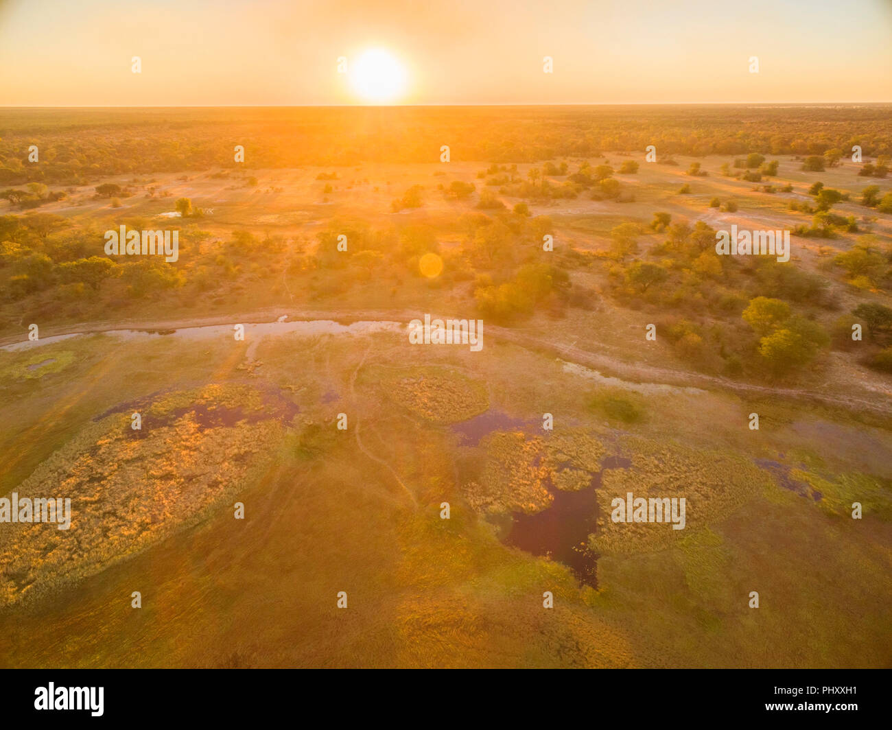 An aerial view of a waterhole in Zimbabwe's Hwange National Park Stock ...