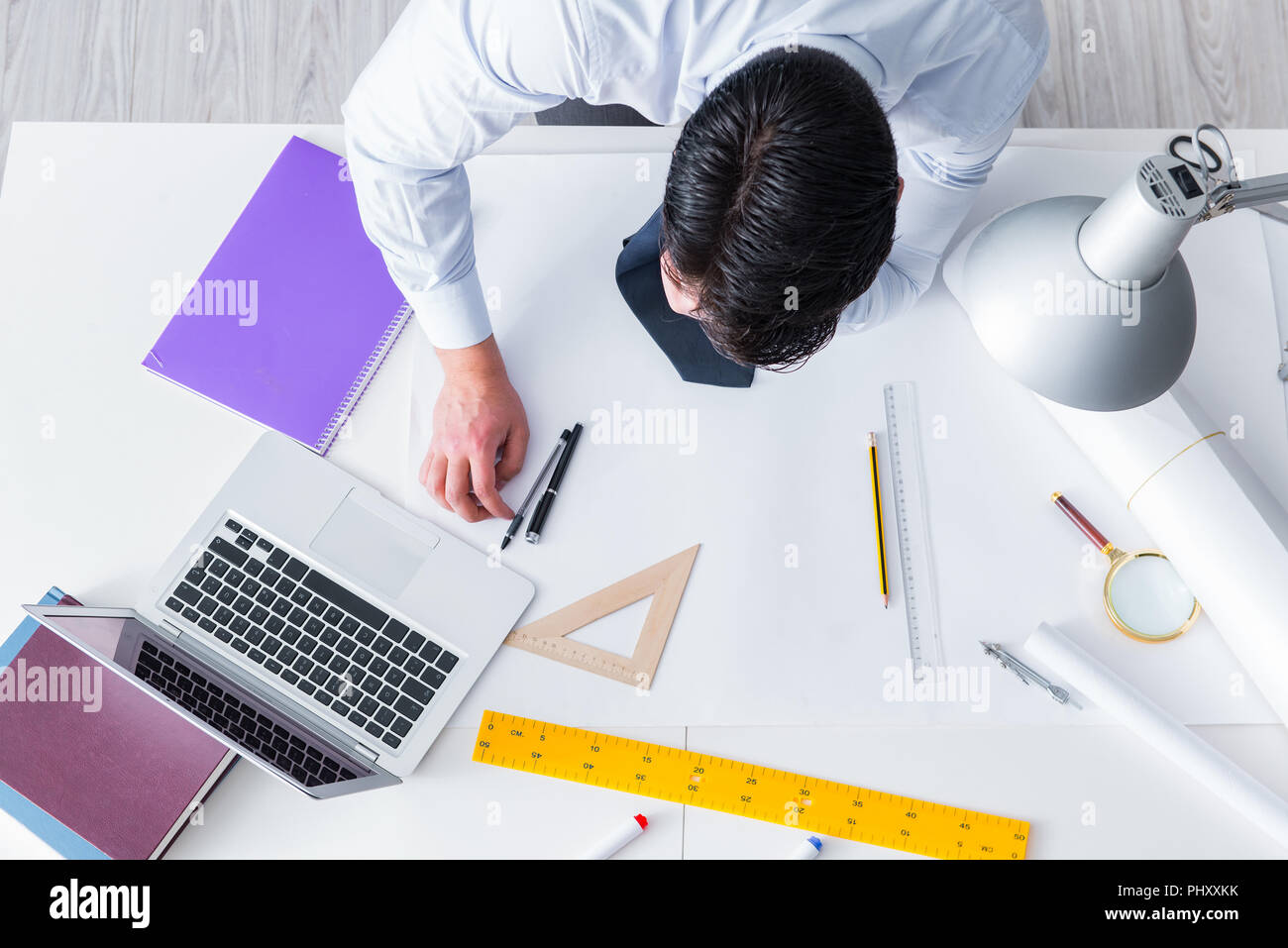 Engineer working on new project drawings Stock Photo - Alamy