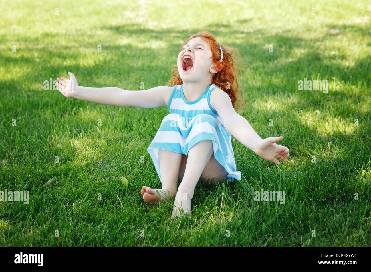 Portrait of cute adorable little red-haired Caucasian girl child in ...