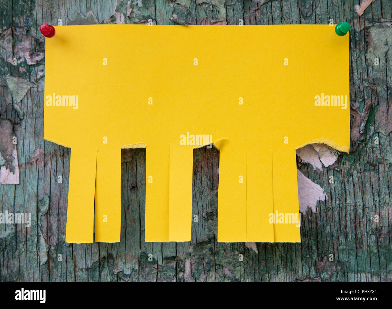 Blank yellow paper with tear off tabs Stock Photo - Alamy