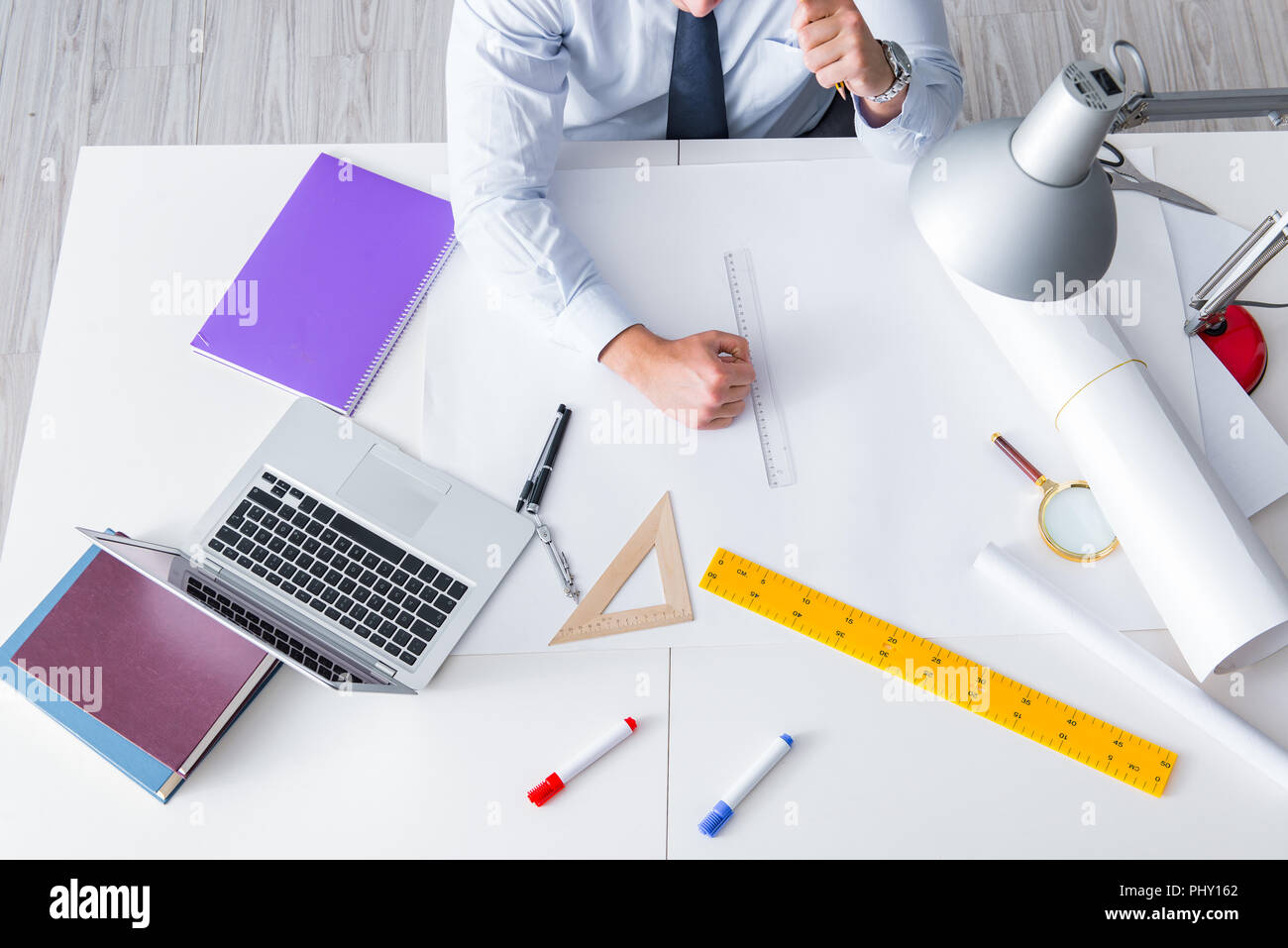 Engineer working on new project drawings Stock Photo - Alamy