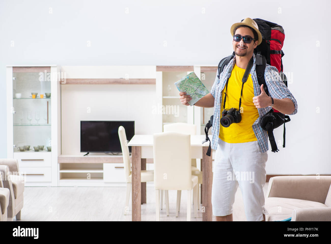 Man planning his travel with map Stock Photo - Alamy