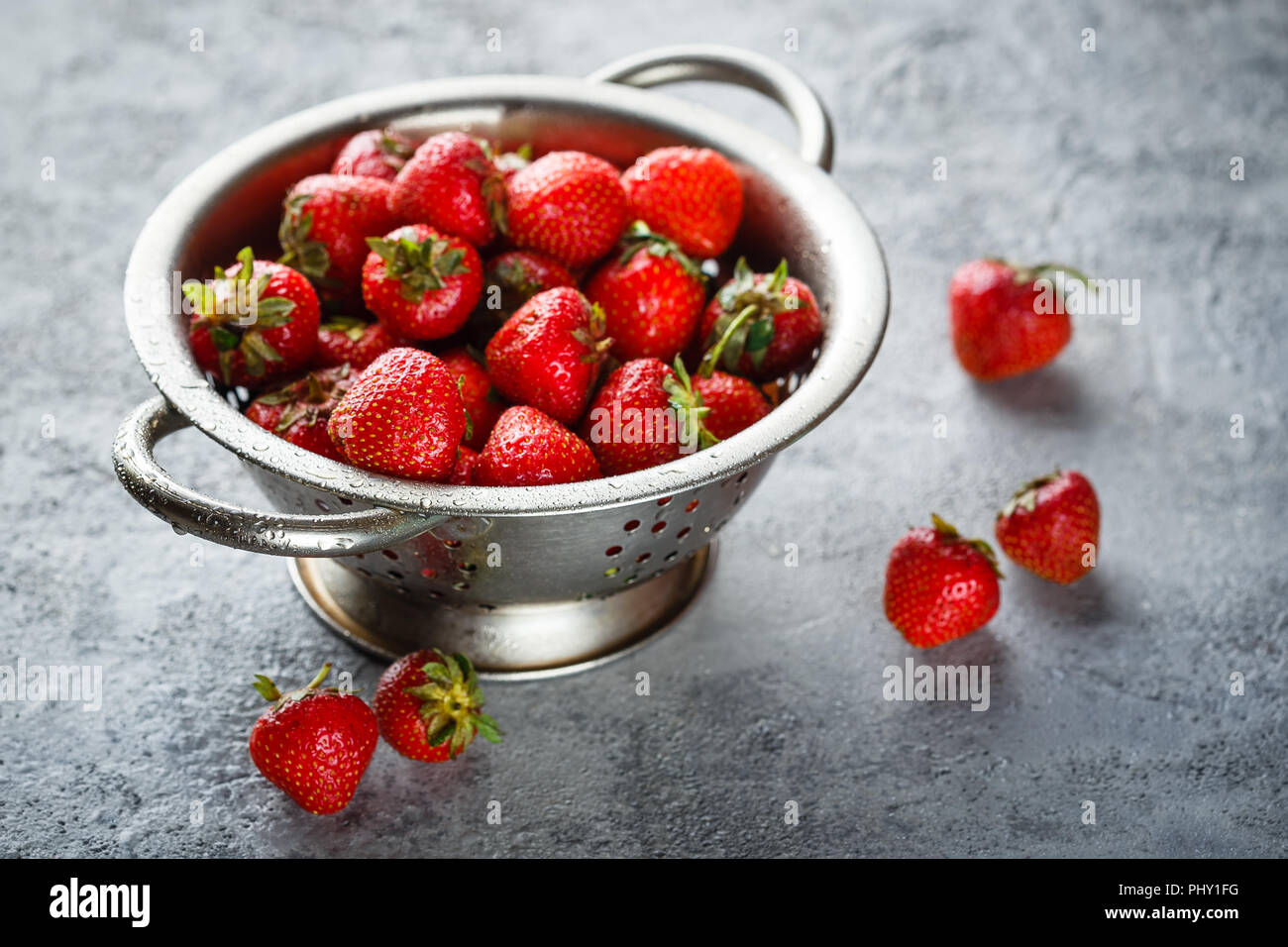 Ripe strawberry in colander Stock Photo - Alamy