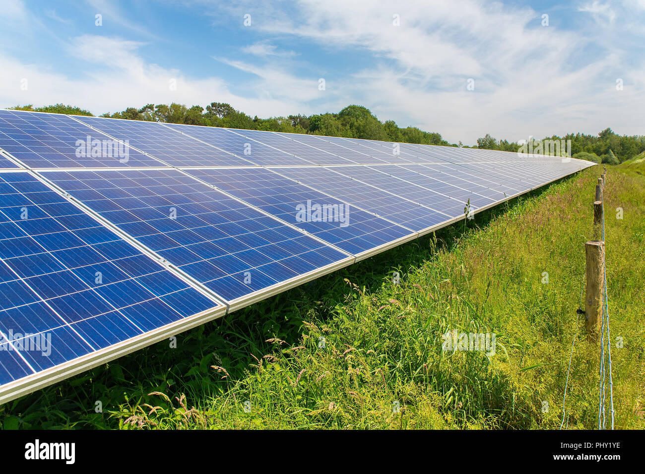 Long diagonal row of blue solar panels Stock Photo - Alamy